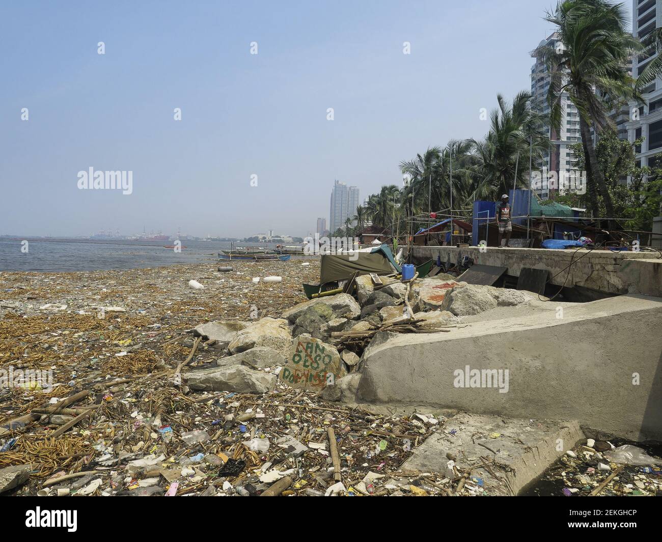 Heaps of various trash and waste lines up near the sewerage outfall of ...