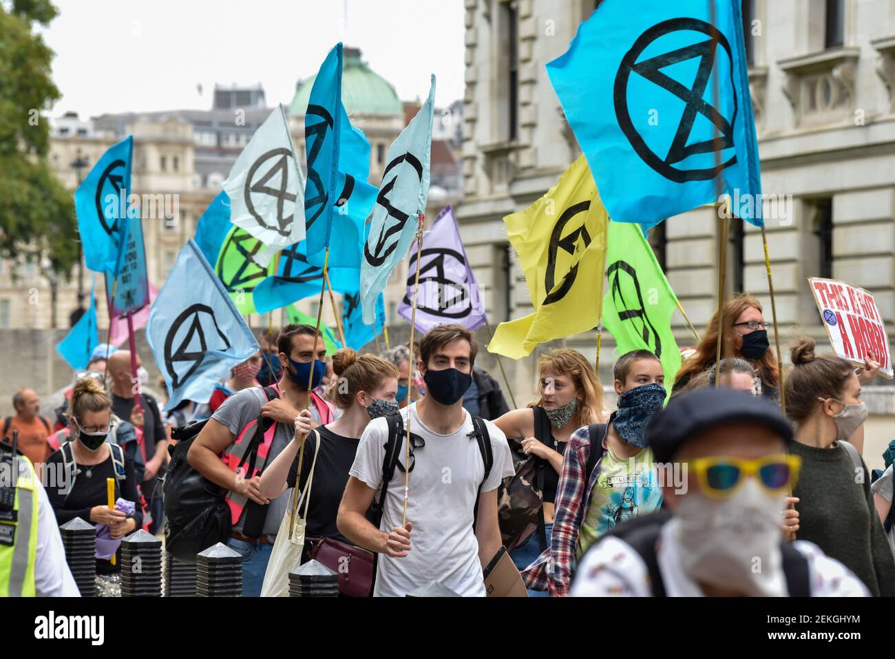 Protesters marching with flags during the demonstration. Outside the HM ...