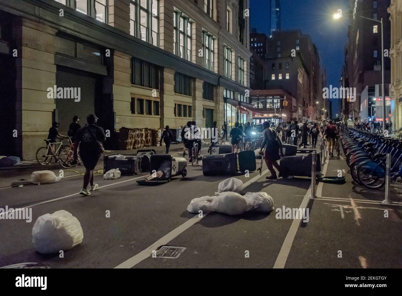 Far-left demonstrators knock over trash cans and leave them in the ...