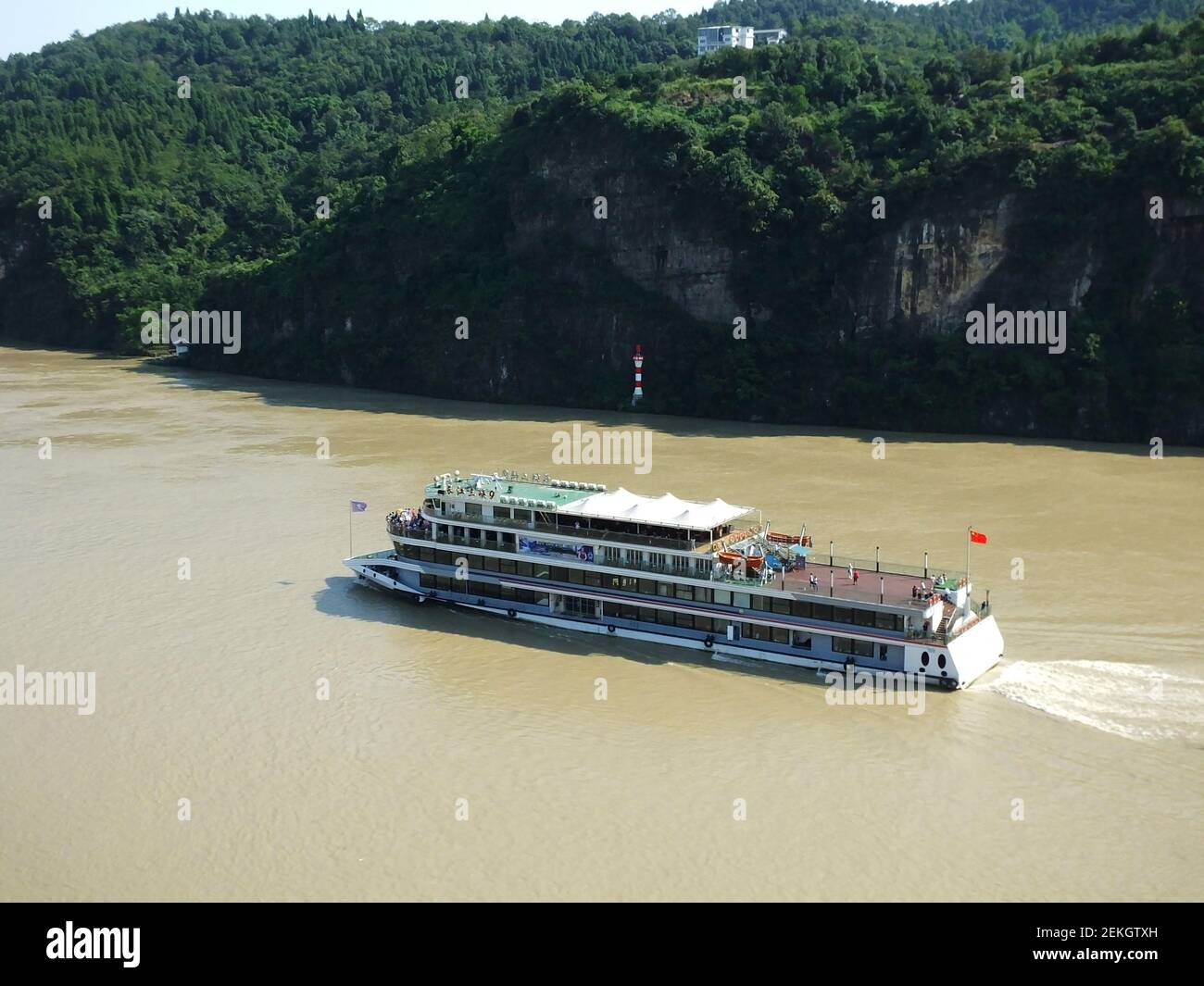 An aerial view of a ship cruising through Xiling Gorge, the largest and ...
