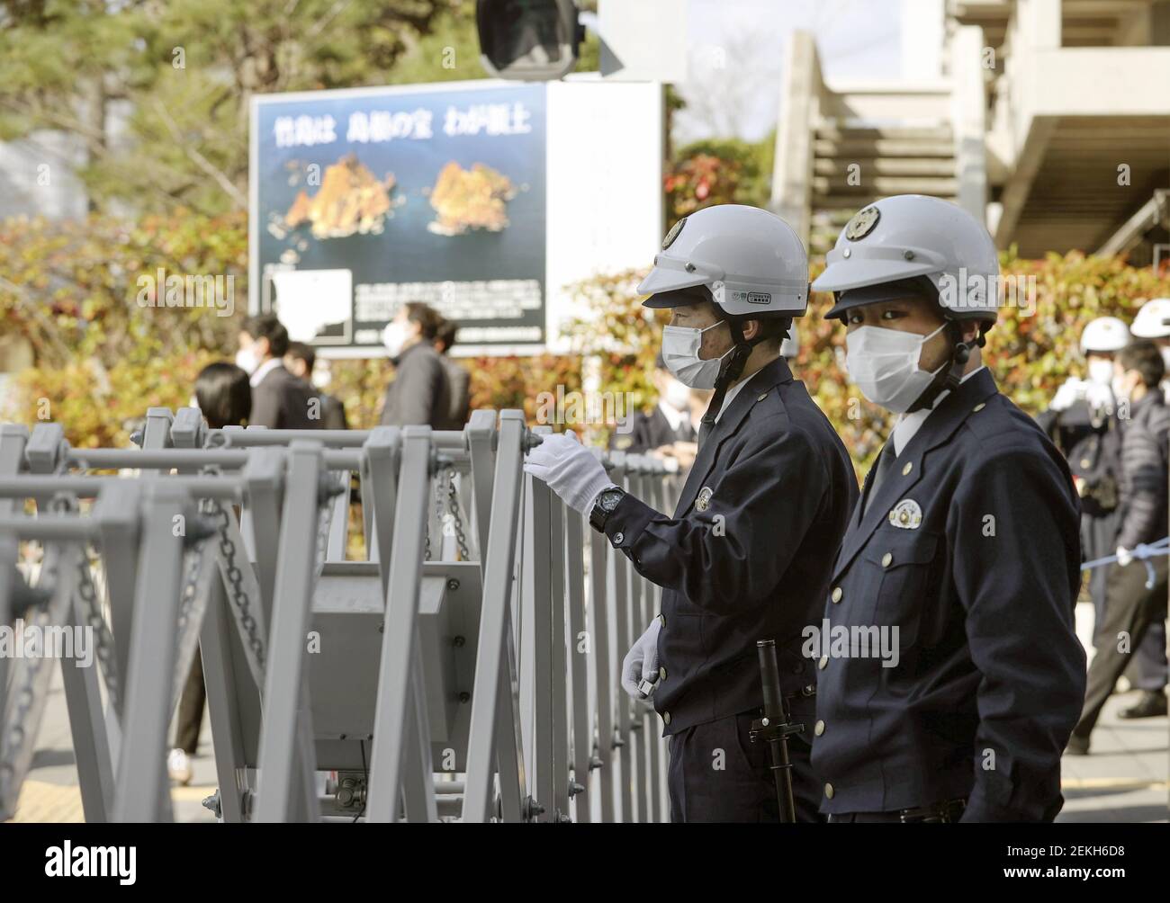 Police officers stand guard near the venue of the "Takeshima Day ...