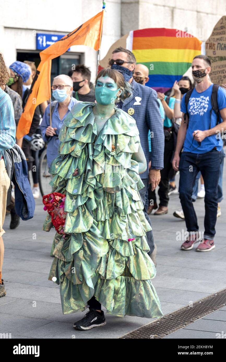 A protester dressed to represent pollution in the oceans takes part ...