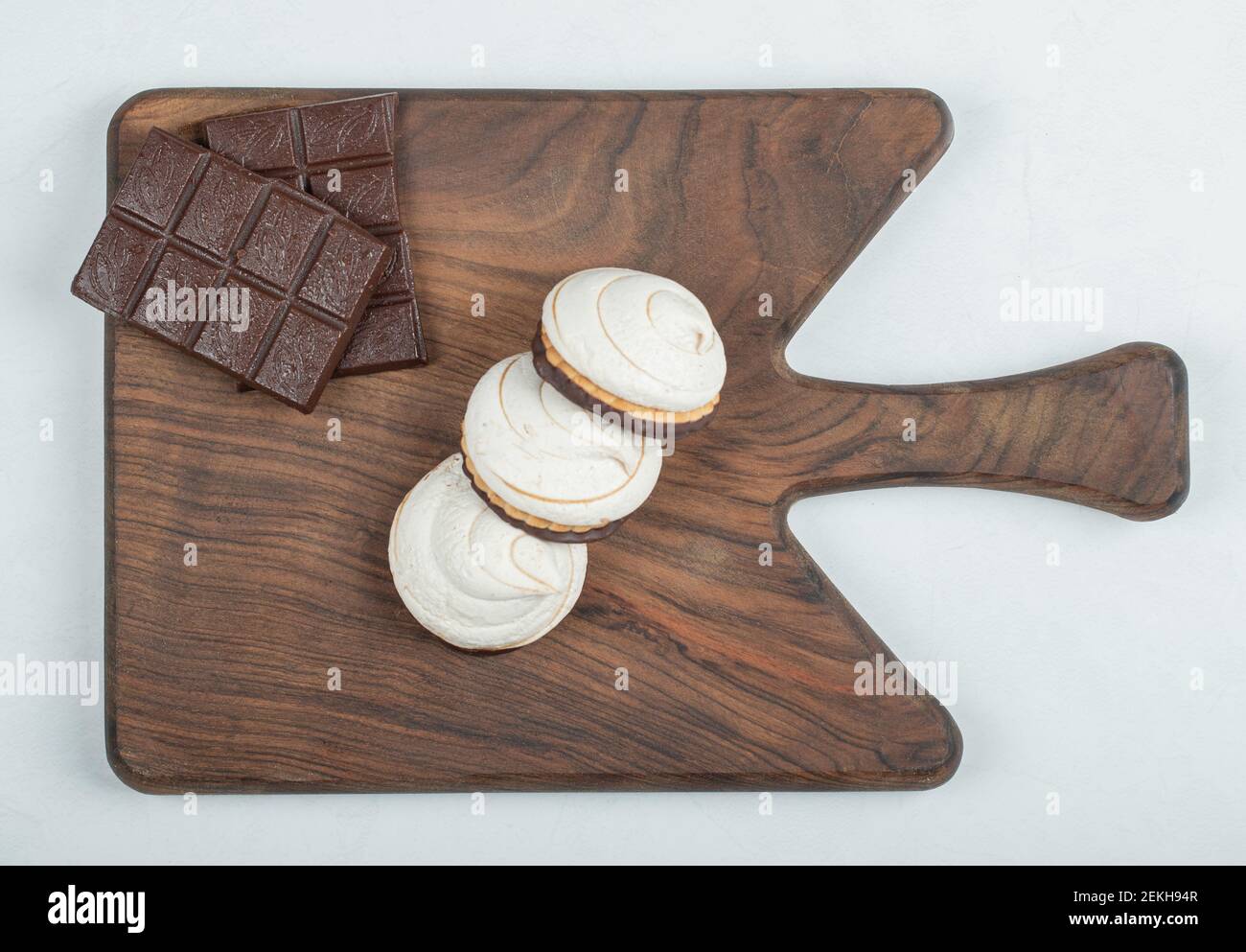Delicious cupcakes with chocolate bars on a wooden board Stock Photo ...