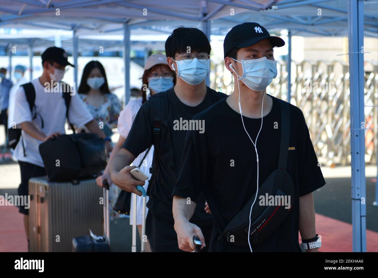 Students of Hainan University wearing face masks return to school ...