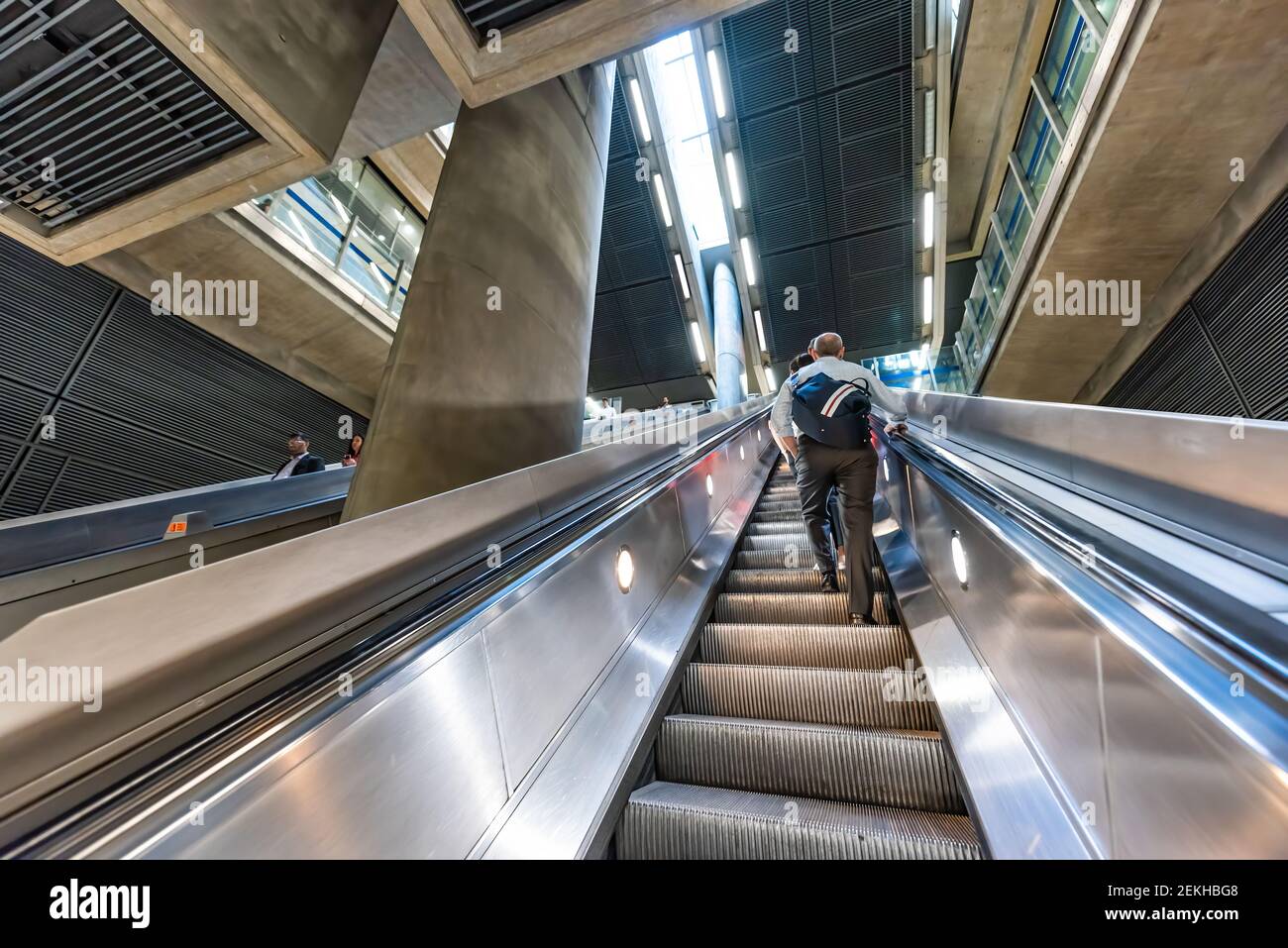 London, UK - June 26, 2018: People commuters riding escalators up ...