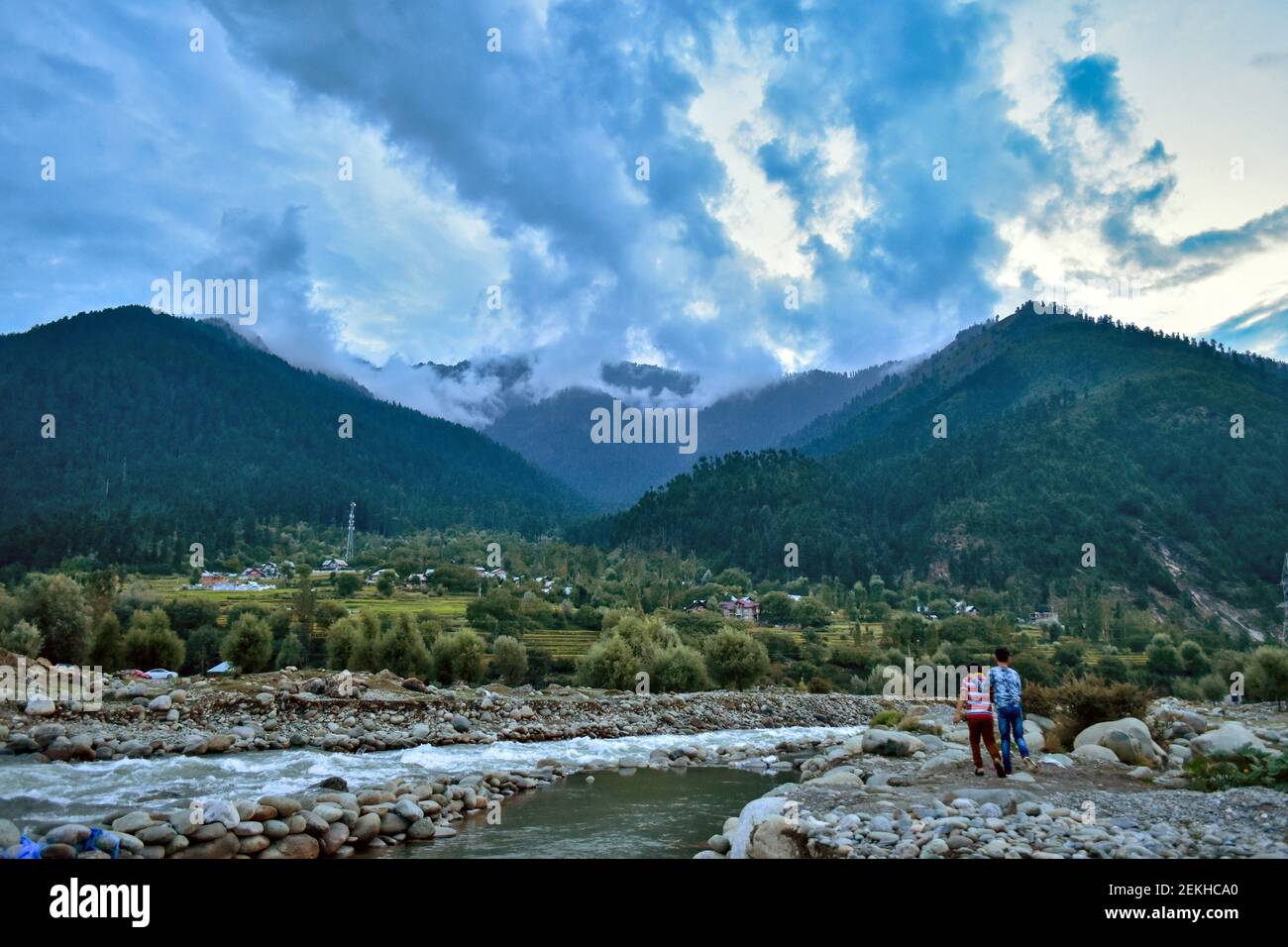 Visitors walk near a river in Ganderbal, some 25kms from Srinagar, the ...