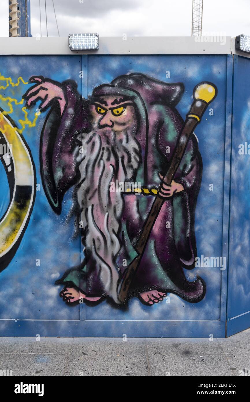 A Wizard on a mural of the word Paranoid on a Balfour Beatty hoarding ...