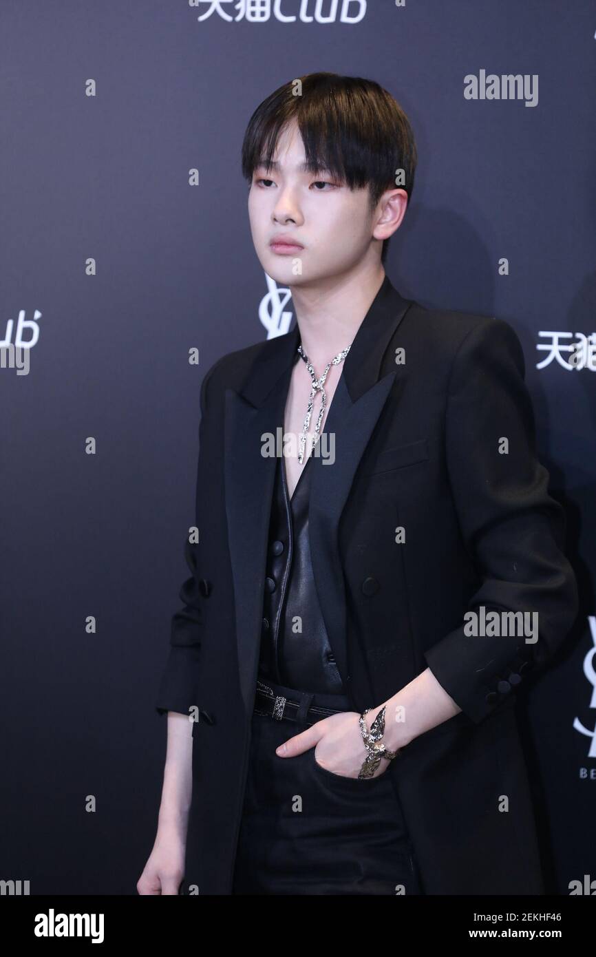 Chinese rapper, singer, songwriter and dancer Zhou Zhennan shows up in black suit, posing to ...