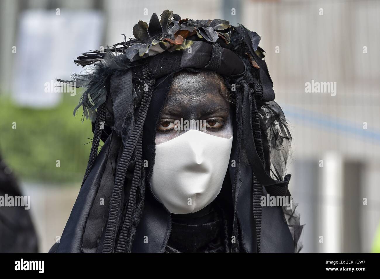 Member of the Black Brigade seen during the performance. Extinction ...