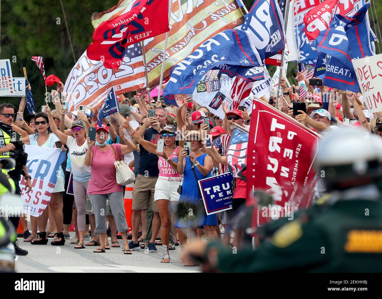 Supporters gather as President Donald Trump arrives at the Jupiter ...