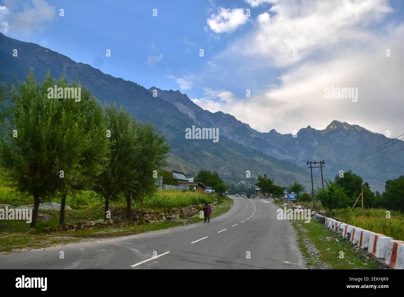 Children walk along a road in Gagangir, about 80kms from Srinagar, the ...