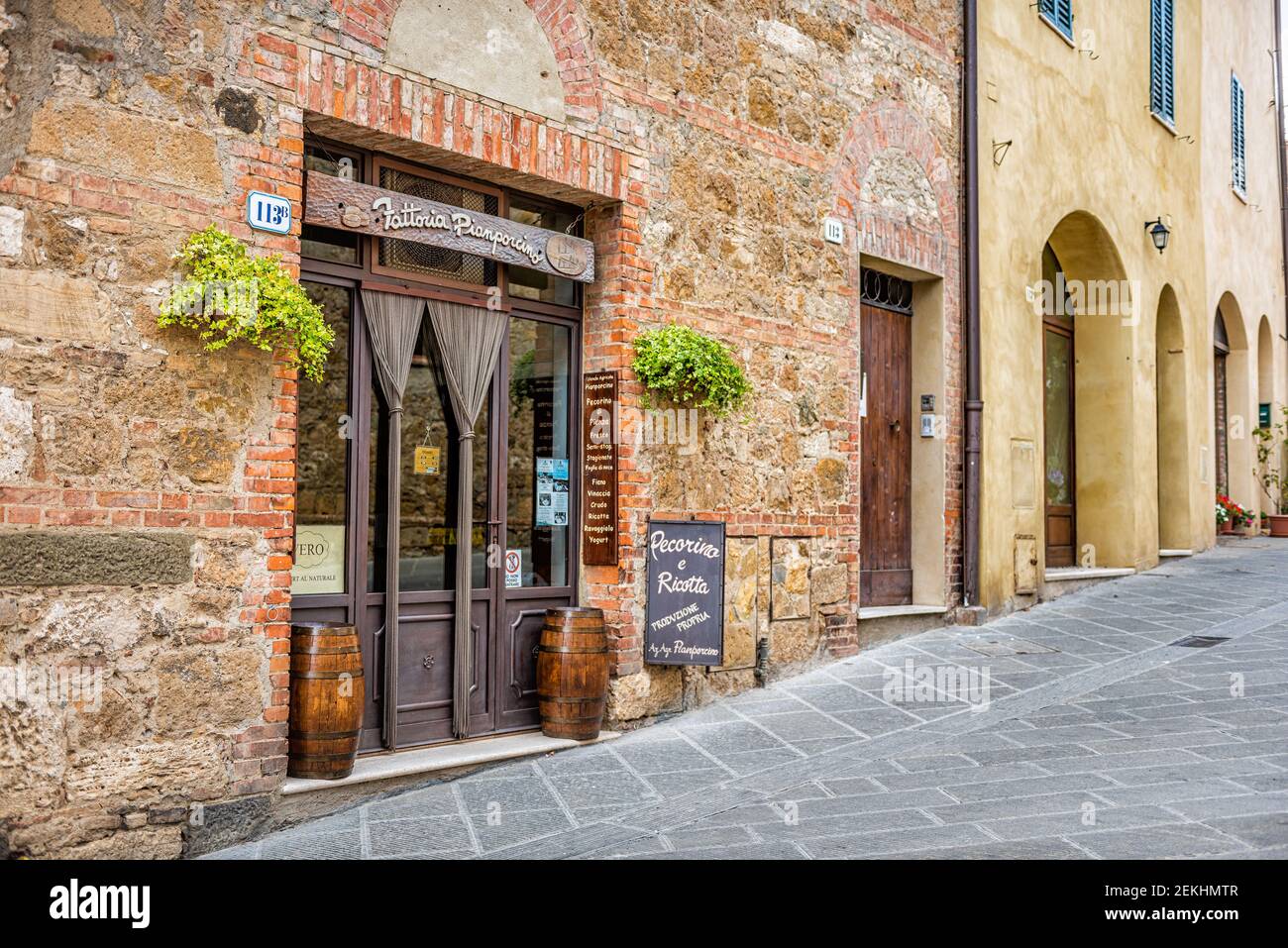 San Quirico D'Orcia, Italy - August 26, 2018: Street in small historic ...