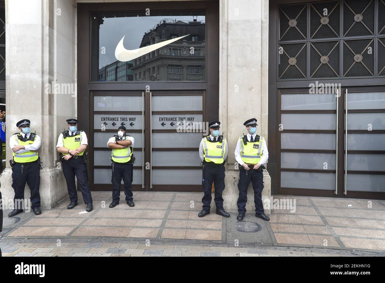Police stand on guard during the Redress the Injustice protest ...