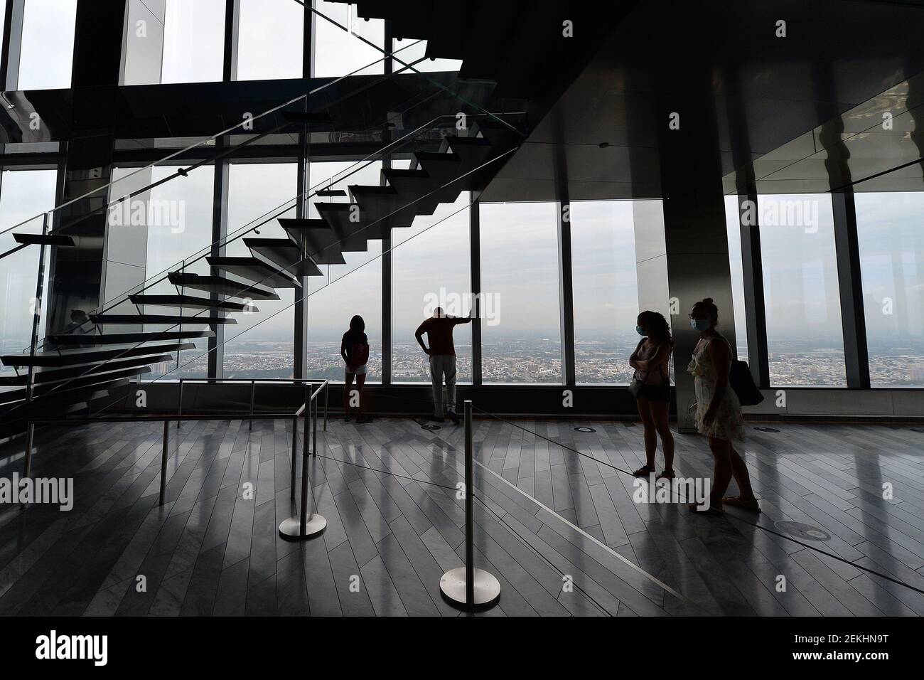 Visitors stand at the windows overlooking New Jersey inside the ...