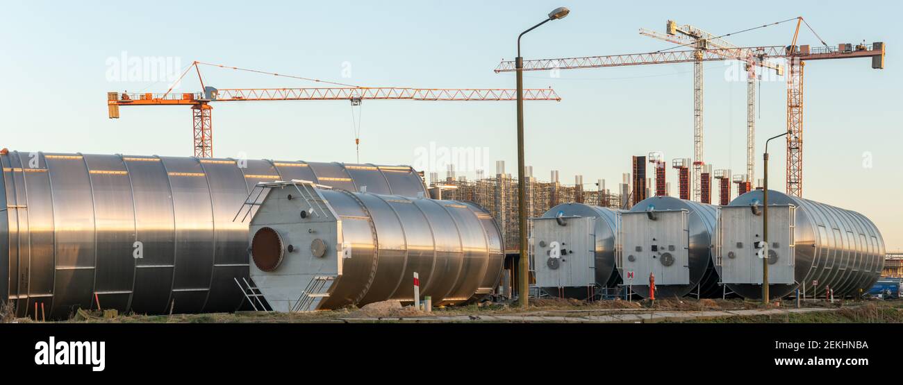 Tanks at the construction site of a polymer factory Stock Photo - Alamy