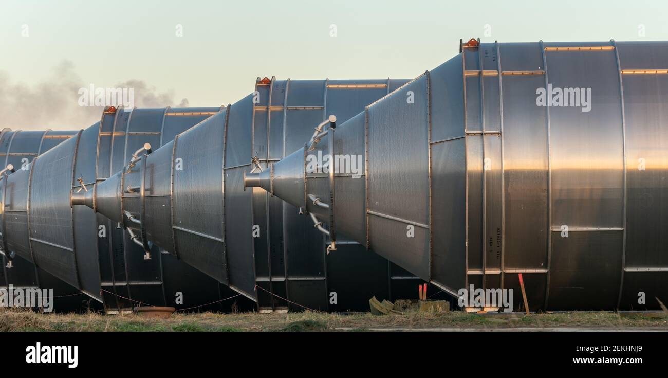 Tanks at the construction site of a polymer factory Stock Photo - Alamy