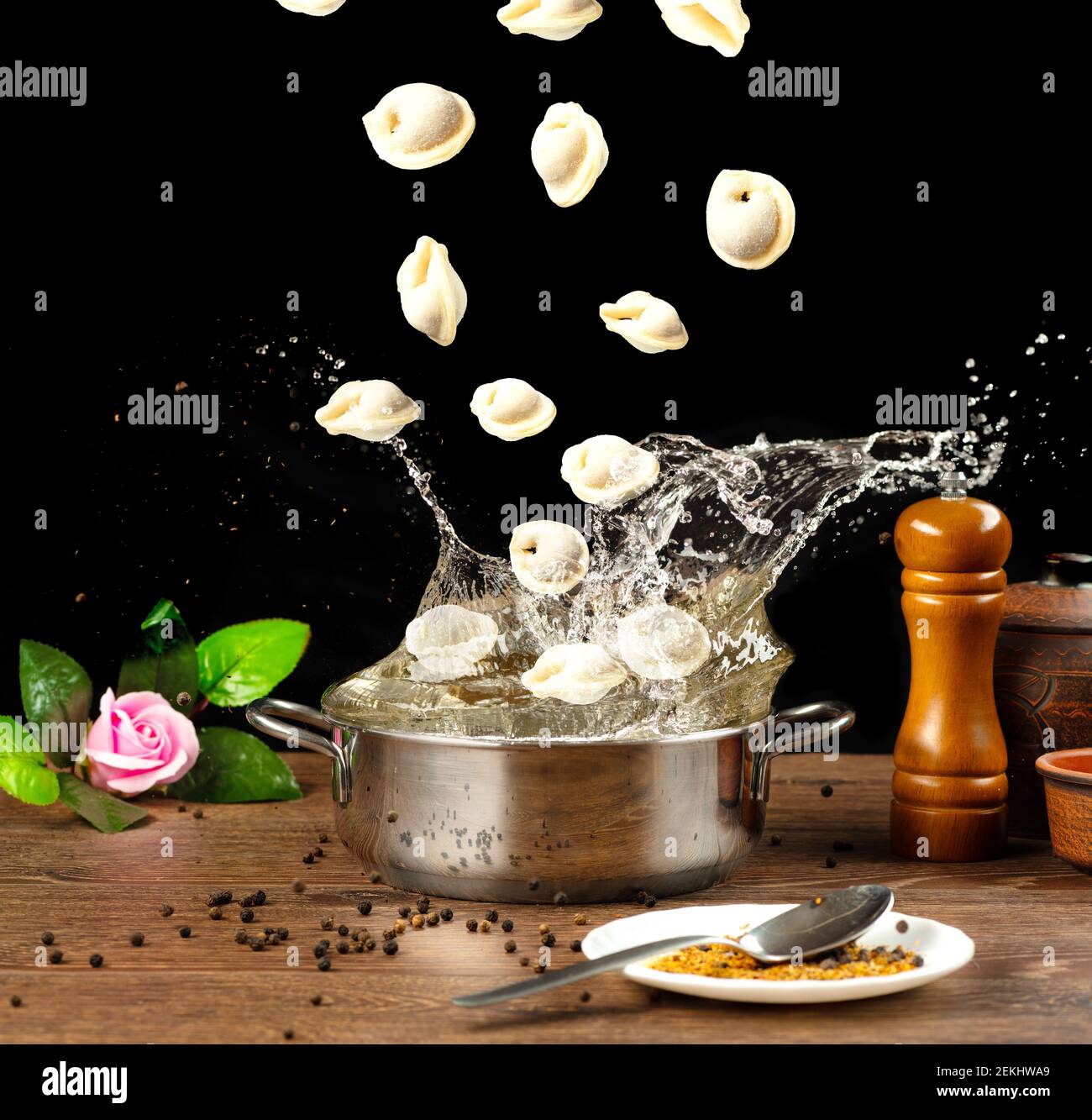 many delicious dumplings fall into a pot of water Stock Photo - Alamy