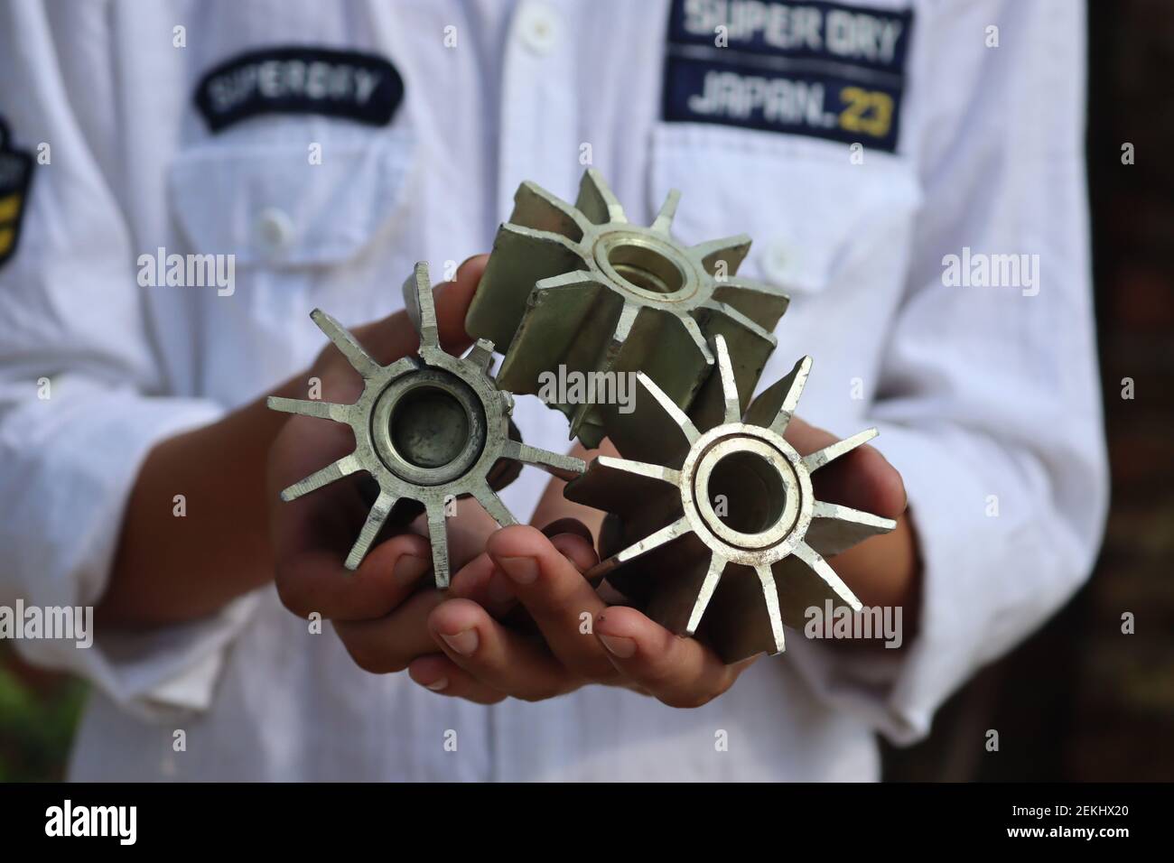 A Man shows parts of a mortar shell after an unprovoked firing by ...