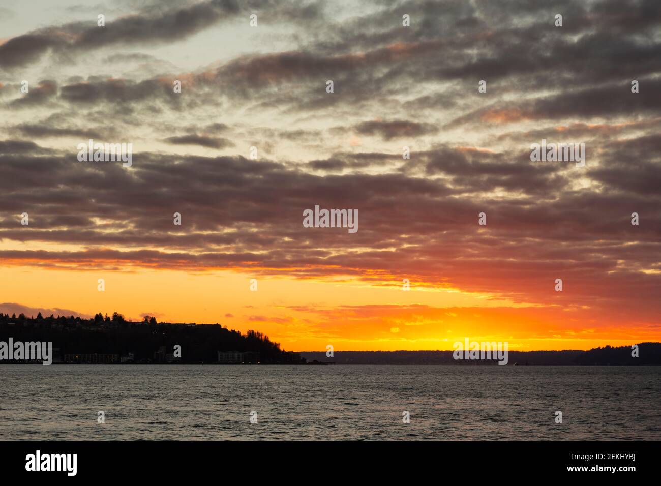 WA19345-00...WASHINGTON - View of the sunset from Pier 62 on the ...