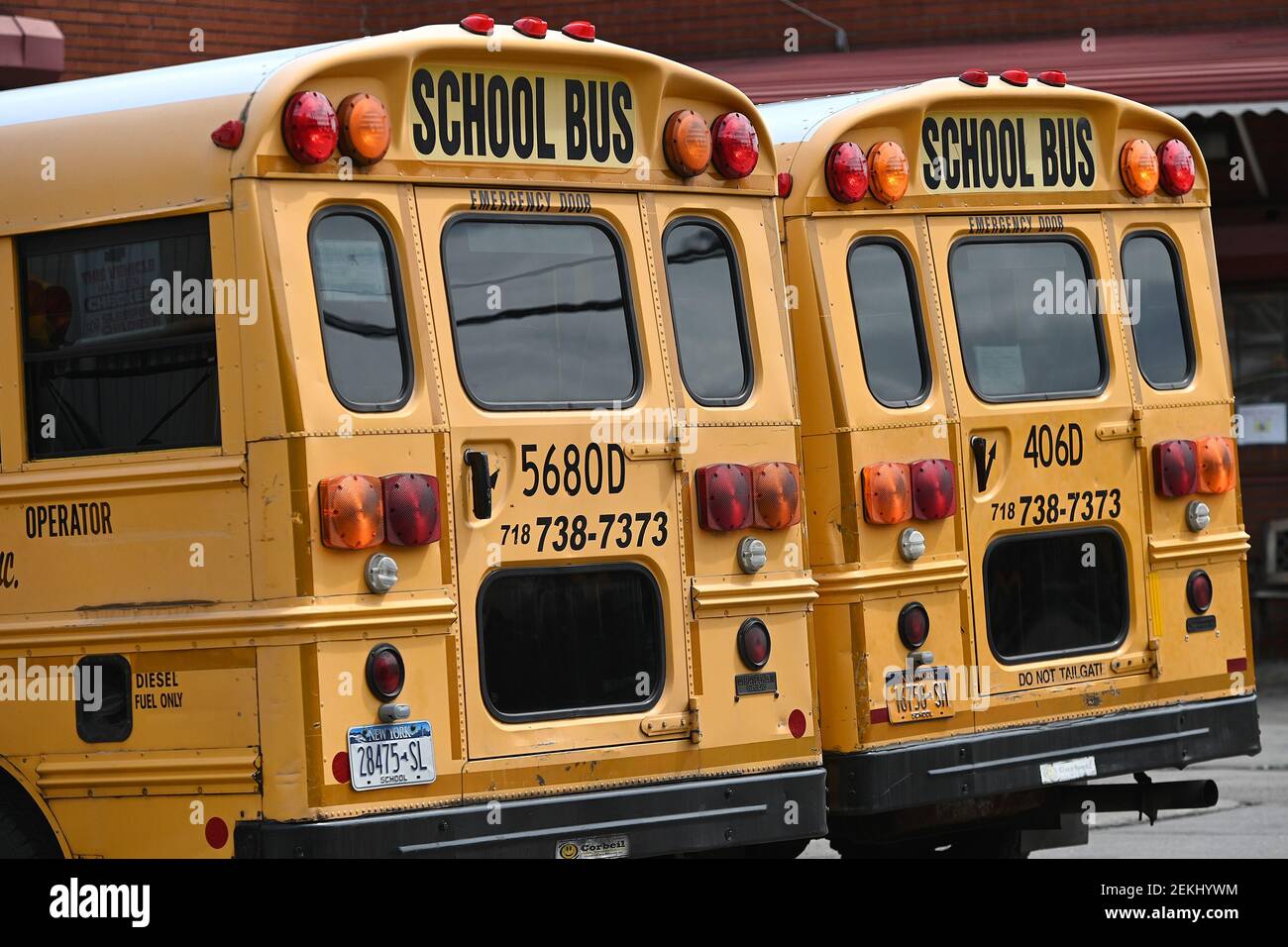 School buses sit idle as September 21st approaches for the reopening of ...