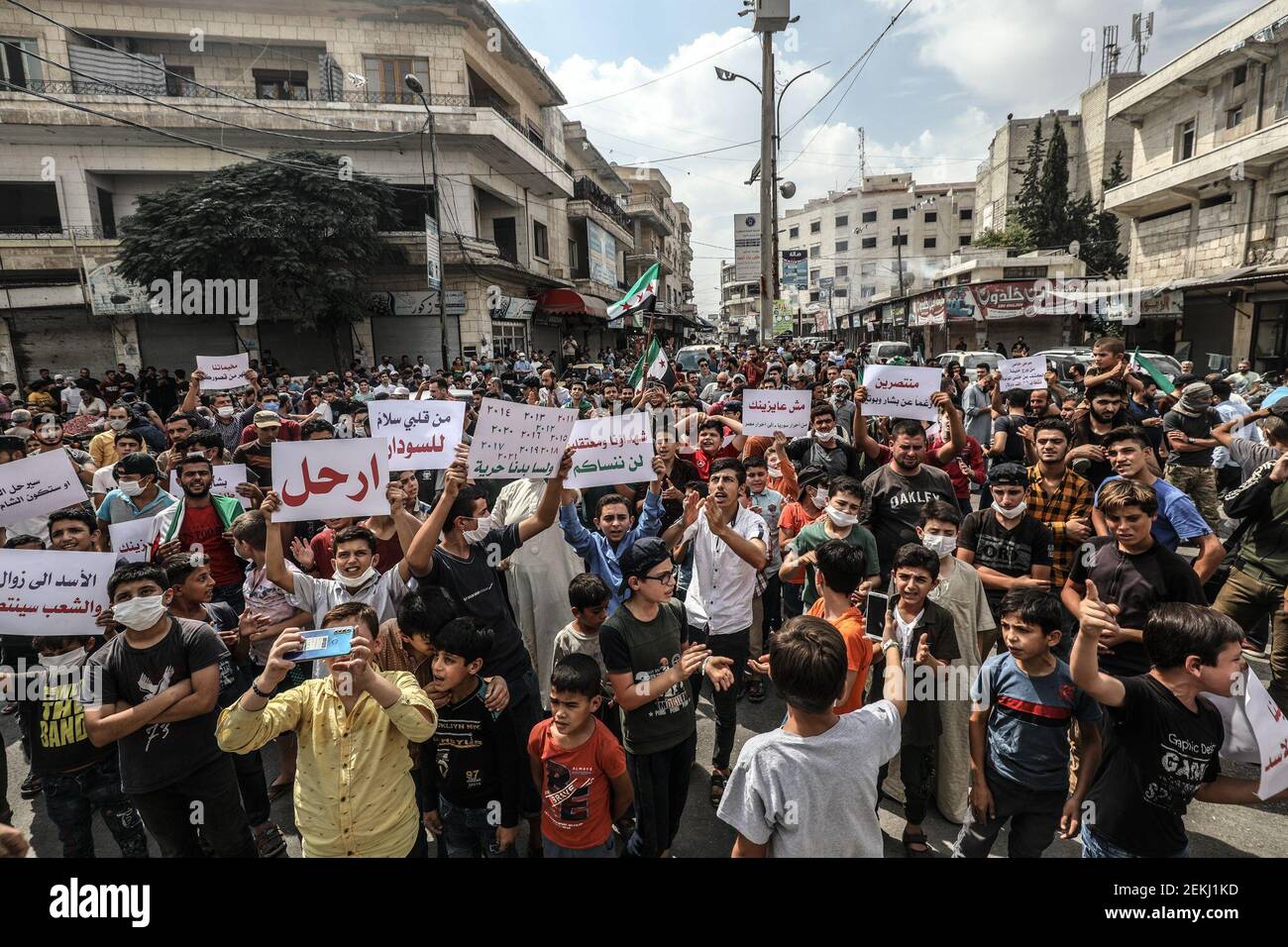 Syrians holds placards during a demonstration against President Bashar ...
