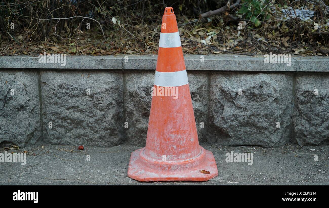 Red Traffic Cone on the Asphalt Road Stock Photo - Alamy