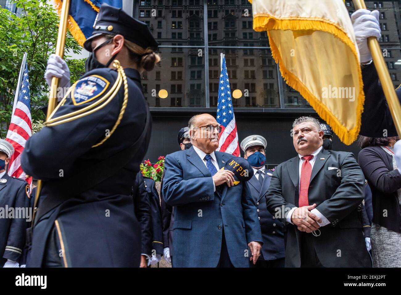 Former New York City Mayor Rudi Giuliani salutes the Honor Guard at the ...