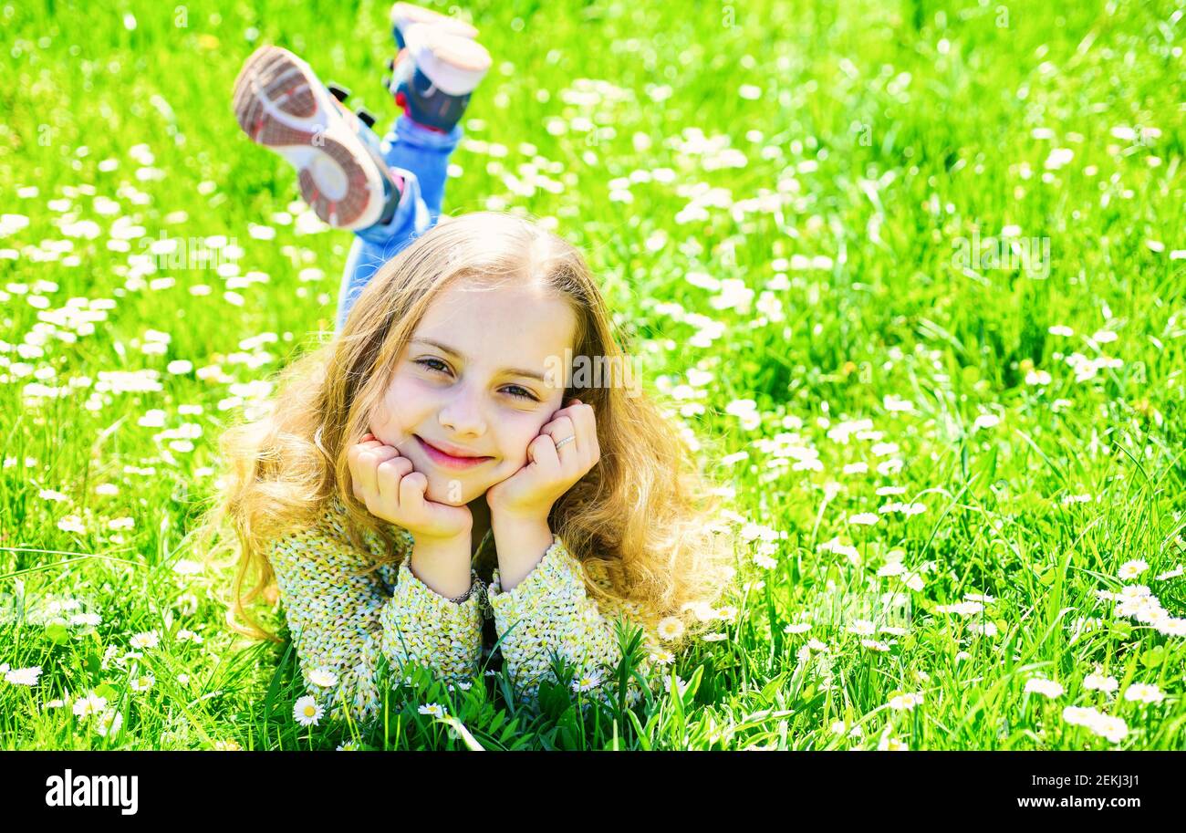 Girl on smiling face spend leisure outdoors. Heyday concept. Child ...