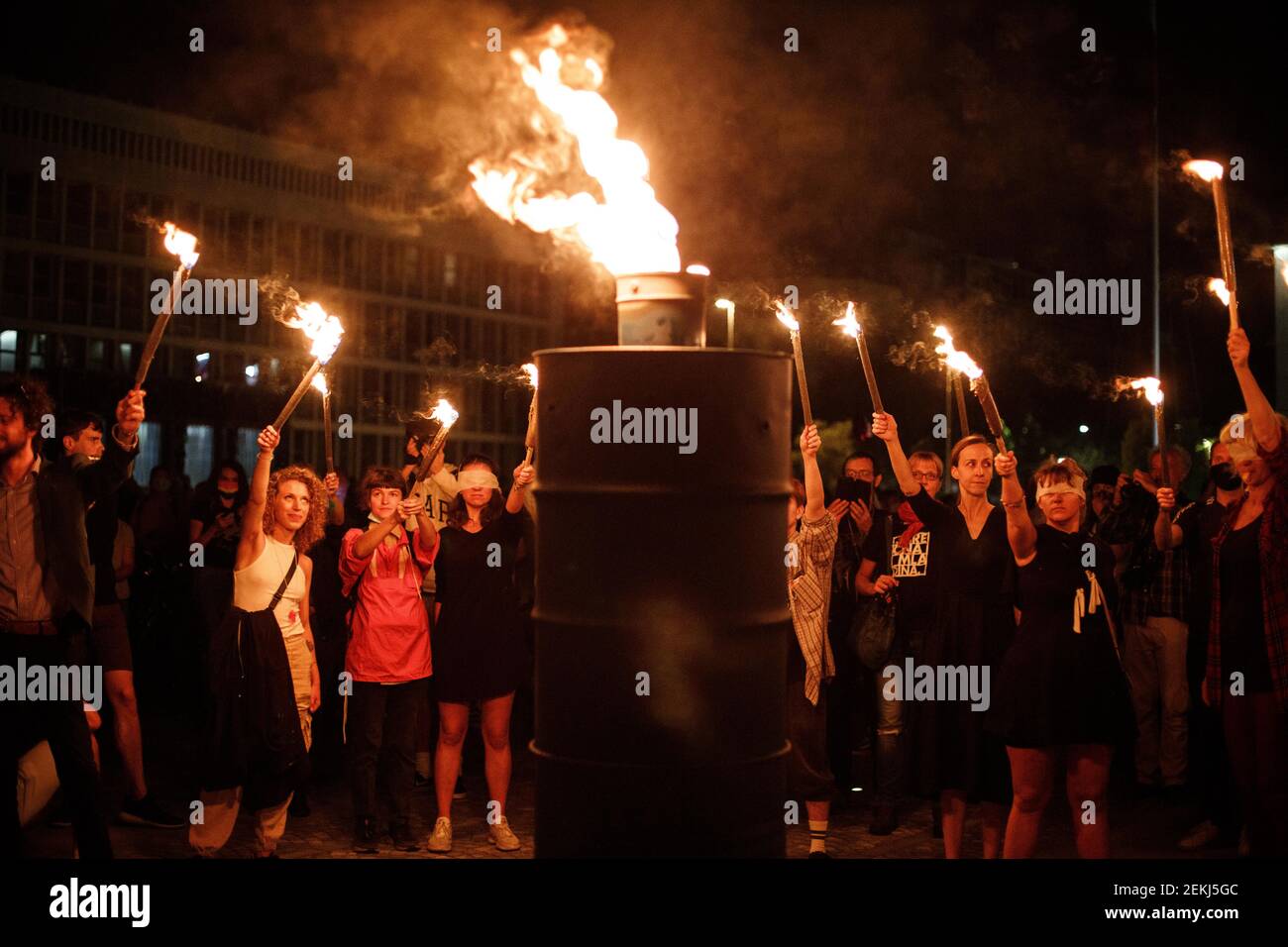 Protesters hold lighting torches as a symbolic flame of resistance ...