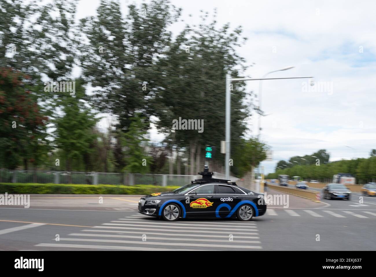 An Apollo Go Robotaxi drives on a road in Beijing, China, 10 September ...