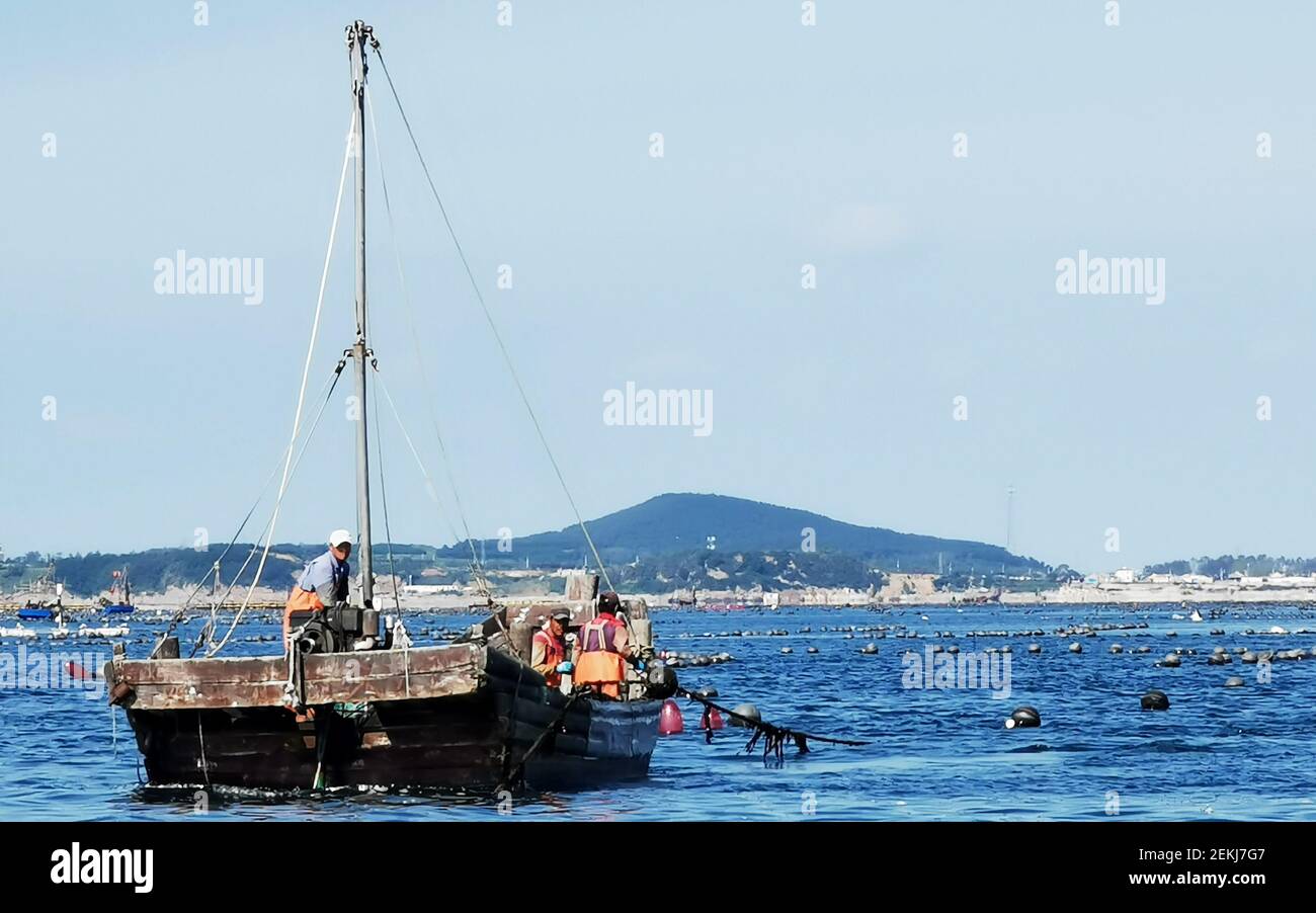 Aerial view of fishermen sailing a boat and fishing at the water aera ...