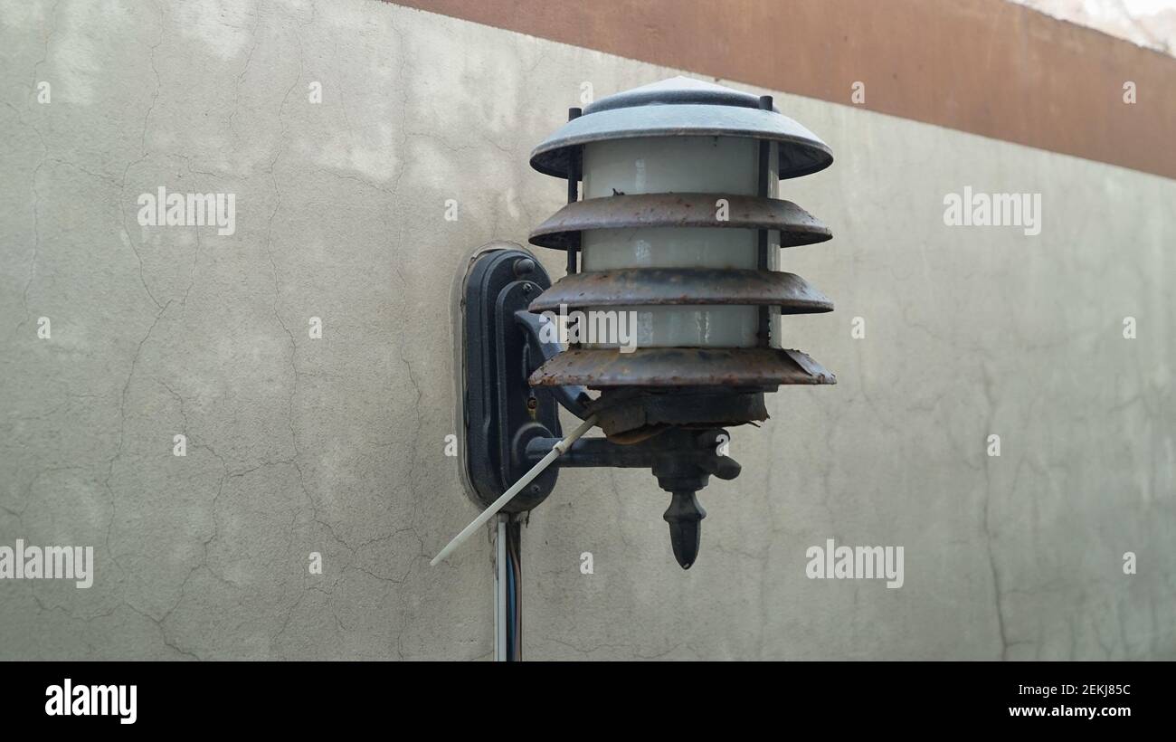 Old and rusty lamps on the wall of villa Stock Photo - Alamy