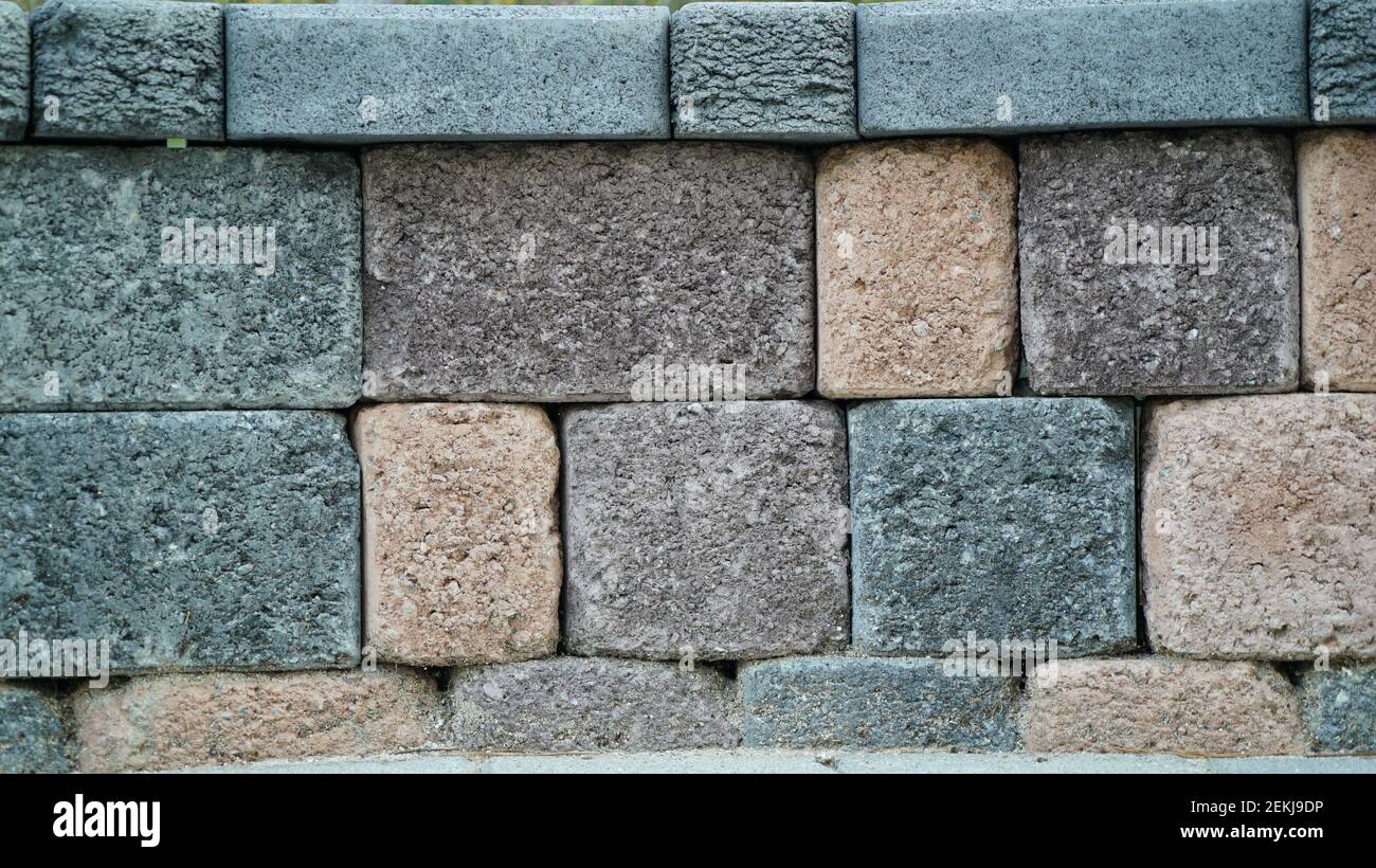 Wall texture with stacked colorful rocks Stock Photo - Alamy