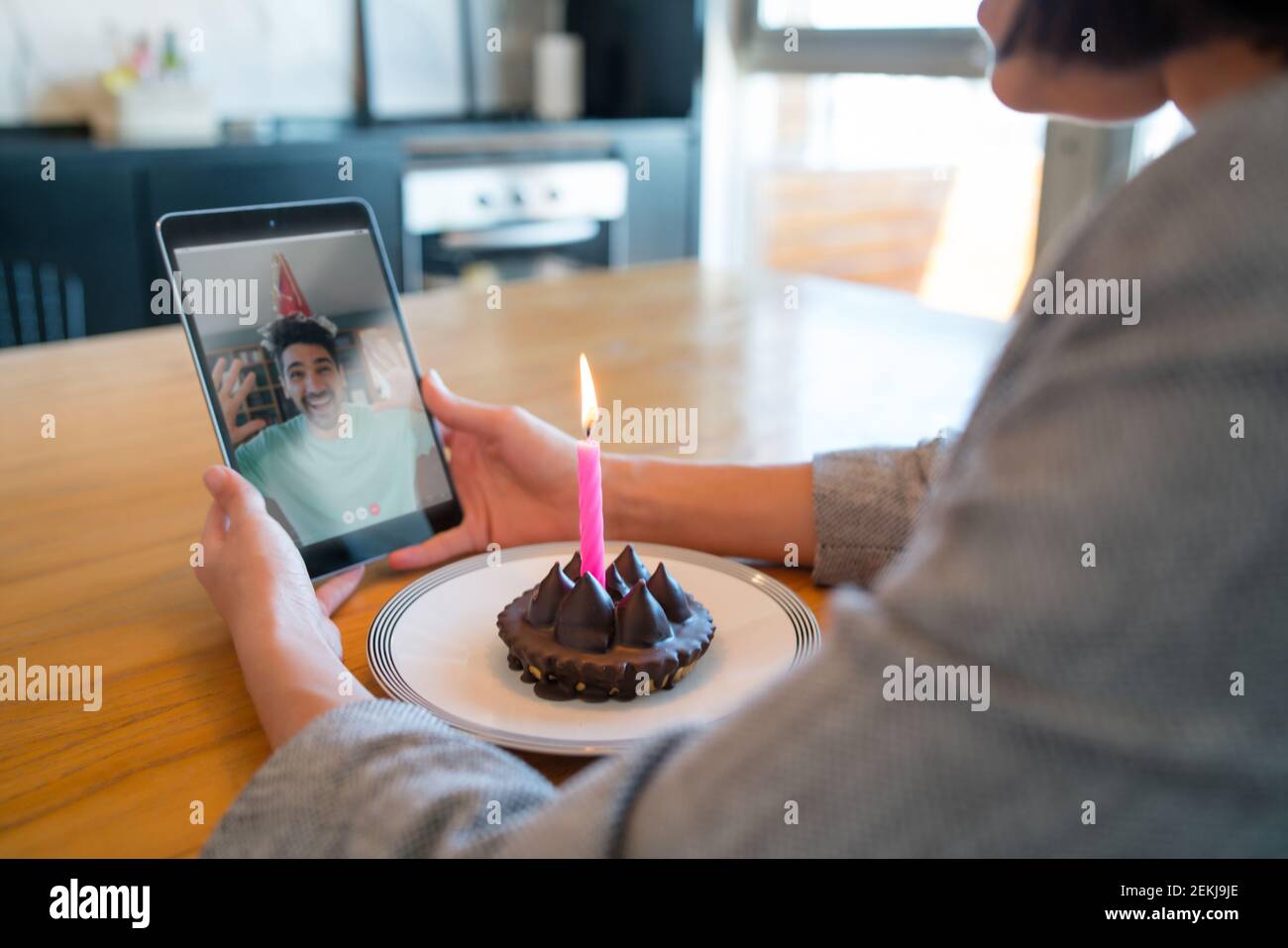 Woman celebrating her birthday on a video call Stock Photo - Alamy