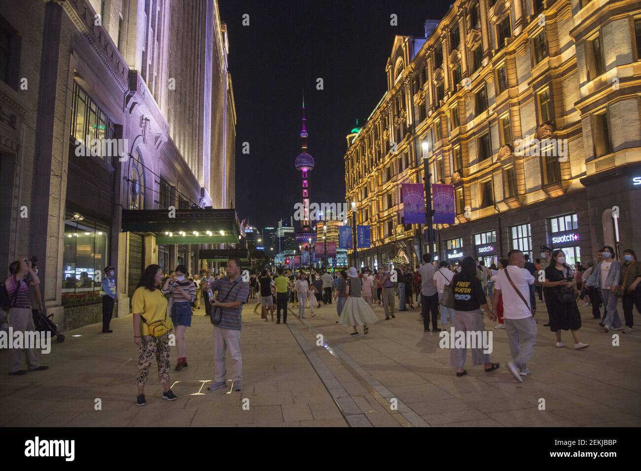 Tourists walk along the East Nanjing Road Pedestrian Street, dubbed China's No. 1 commercial ...
