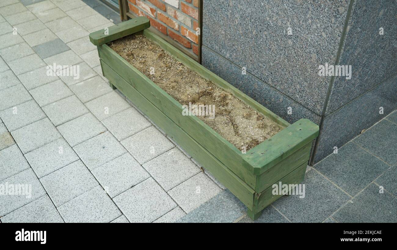 Green Rectangular Flower Pot on the Street Stock Photo - Alamy