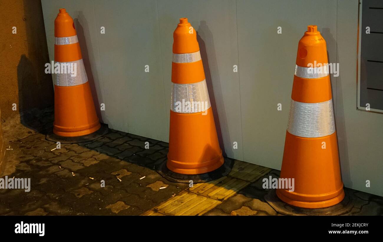 Traffic cones in front of a construction site at night Stock Photo - Alamy