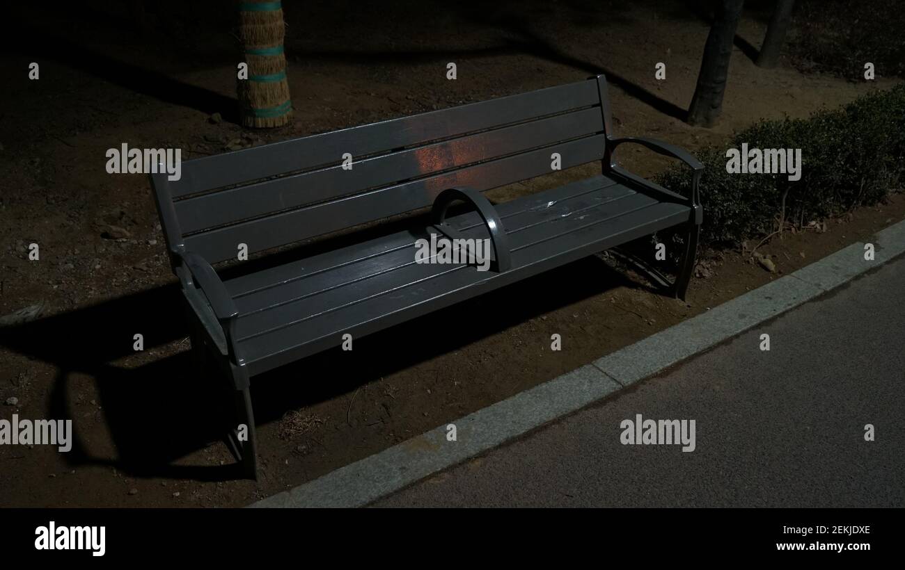 Wooden bench on the Park at Night Stock Photo - Alamy