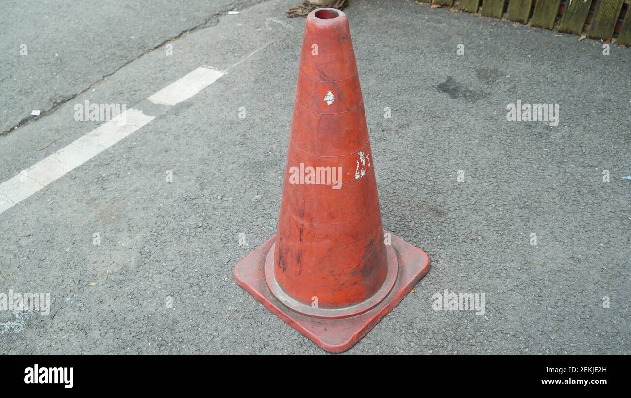Traffic Cone with White Horizontal Stripe Paint Erased on the Asphalt ...
