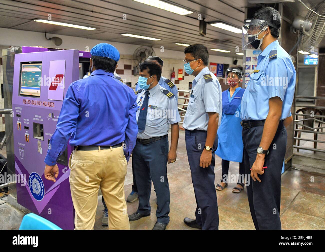 A station Master seen giving instructions to the Metro Railway staff ...