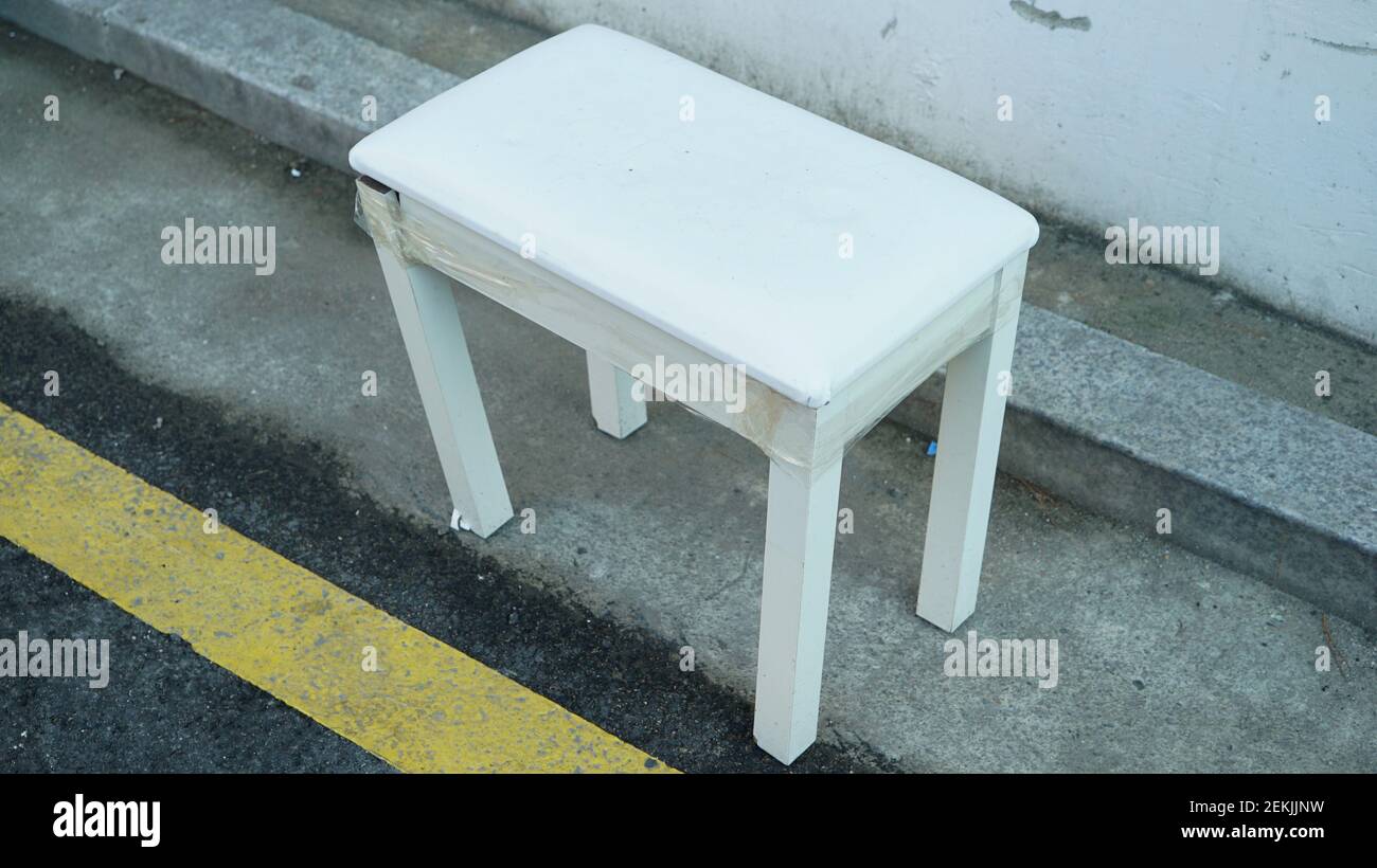 White Chair on the Asphalt Road Stock Photo - Alamy