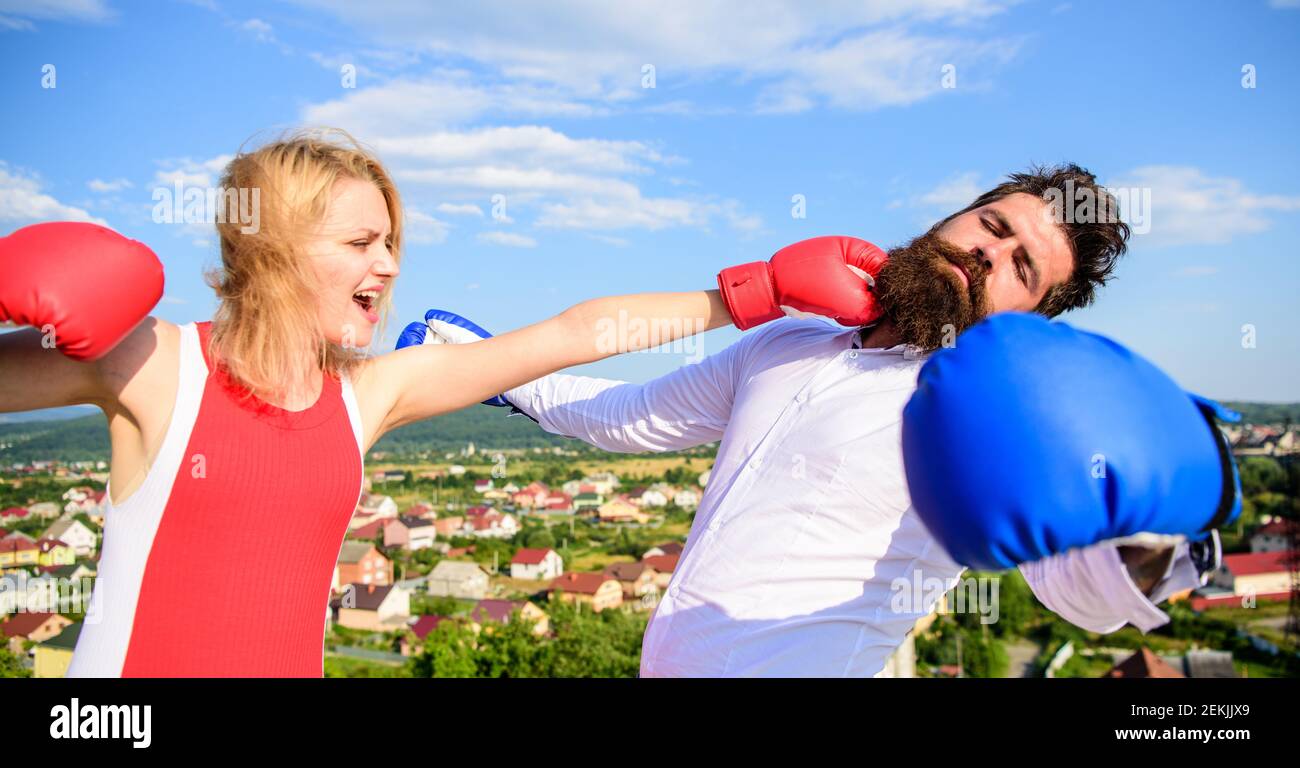 Couple boxing gloves fight sky background. Henpecked guy attacked by ...