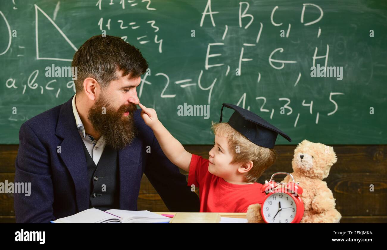 Kid cheerful distracting while studying, attention deficit. Naughty ...