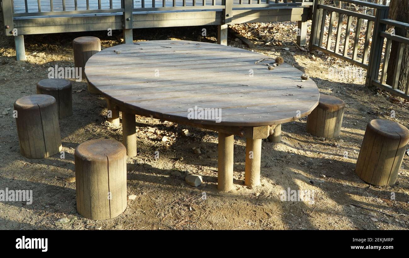 Wooden Round Table and Cylinder Shape Chairs on the Winter Hiking Trail ...