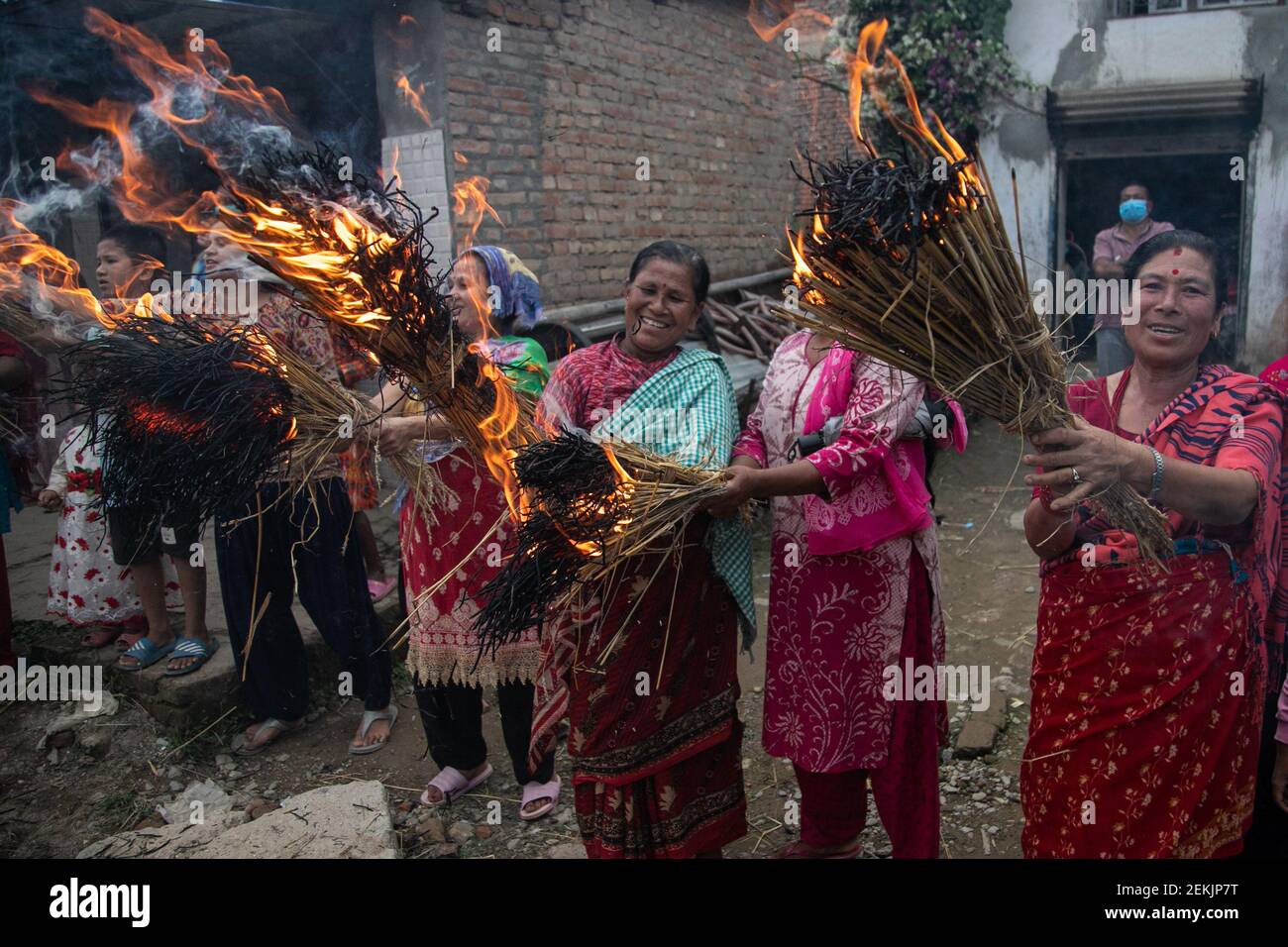 Nepali devotees carry traditional torches on the way to Bungmati temple ...