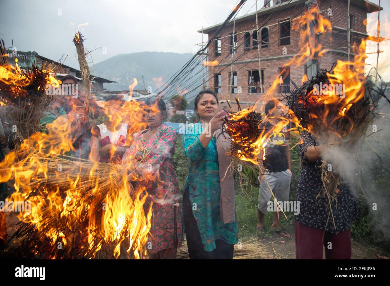 Nepali devotees carry traditional torches on the way to Bungmati temple ...