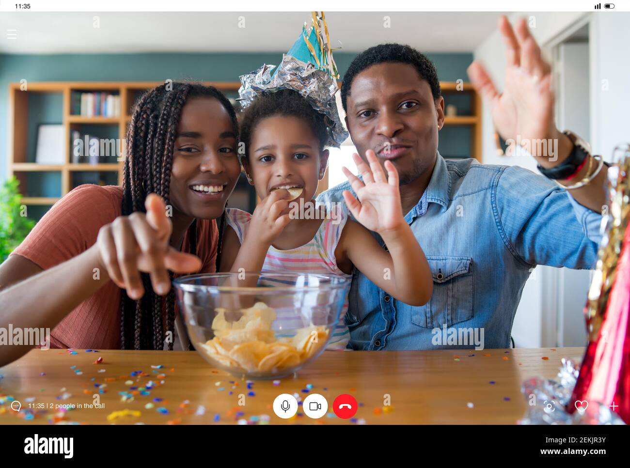 Family celebrating birthday on a video call Stock Photo - Alamy