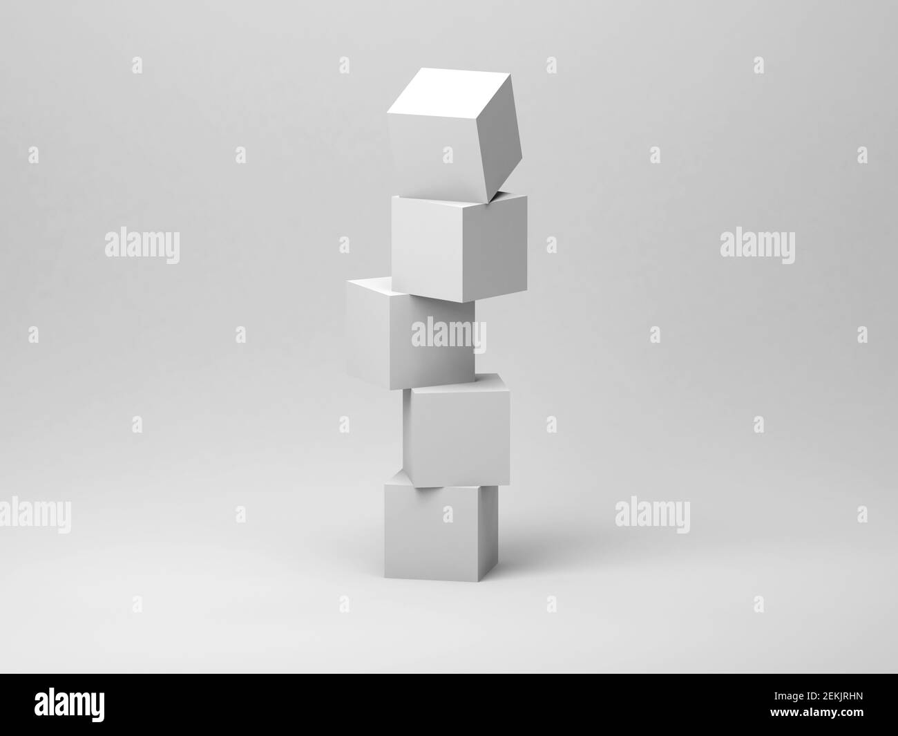 Abstract tower installation of five white cubes in an empty studio room ...