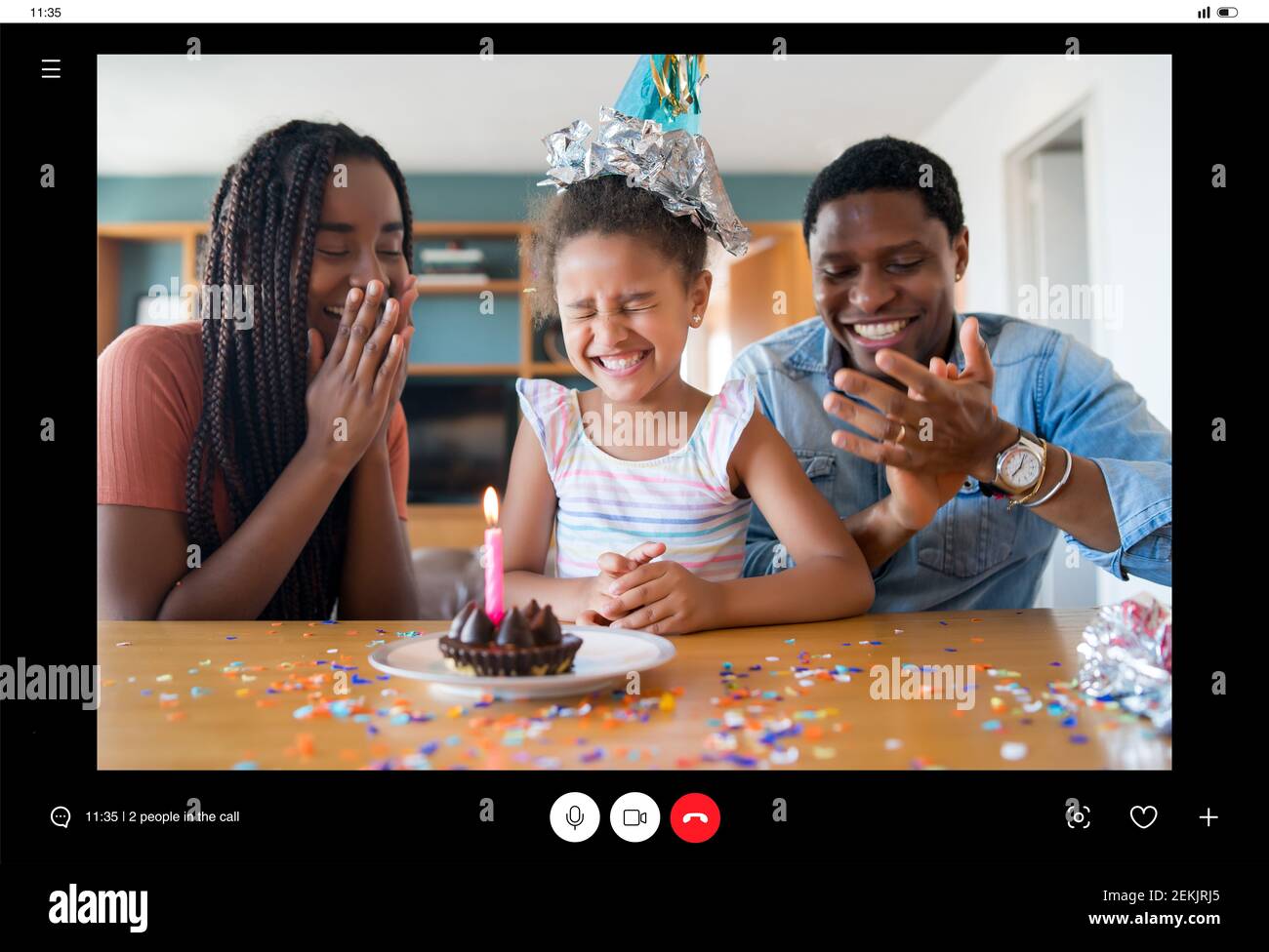 Family celebrating birthday on a video call Stock Photo - Alamy