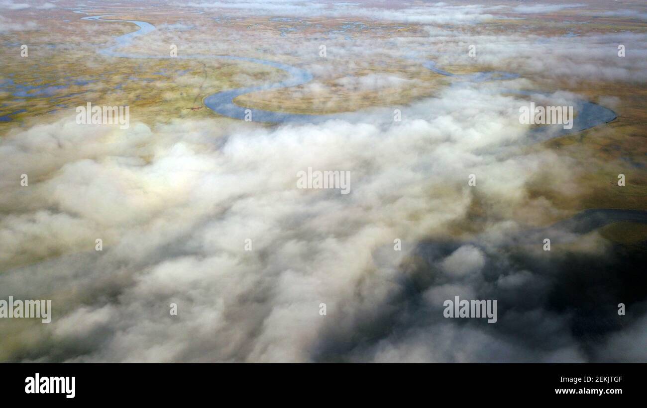The beautiful advection fog above the Bayanbulak Grassland in ...